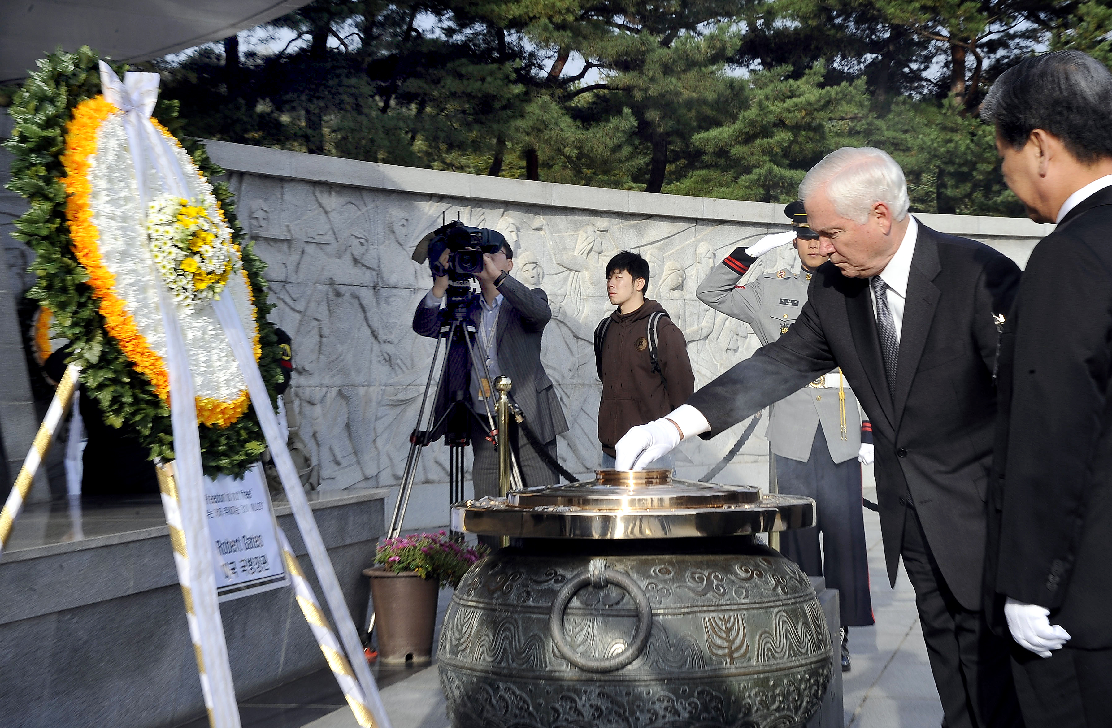U.S. Defense Secretary Robert M. Gates participates in a wreath laying ...