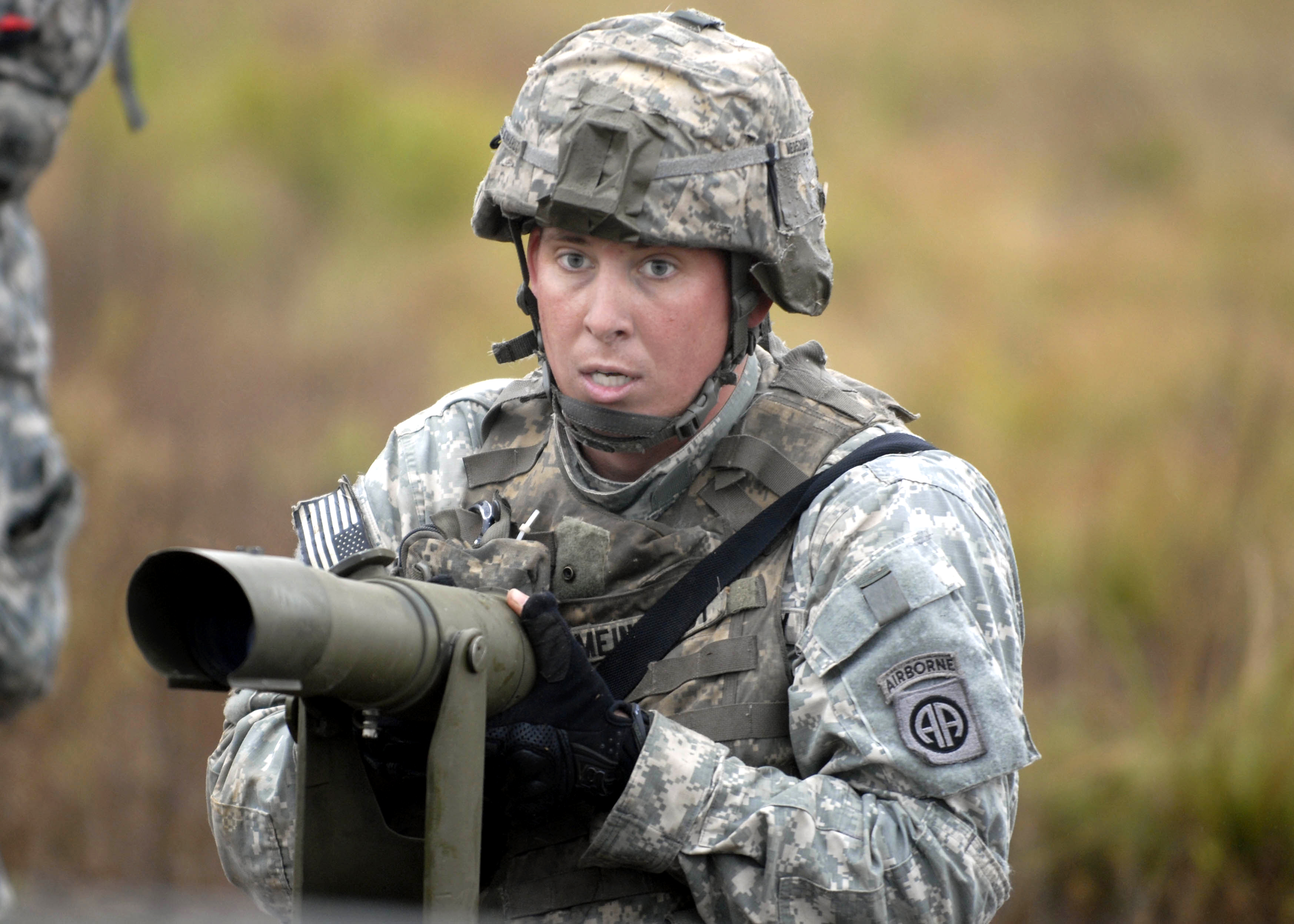 U.S. Army Staff Sgt. Eric Meinhardt calls out measurements to prepare a ...