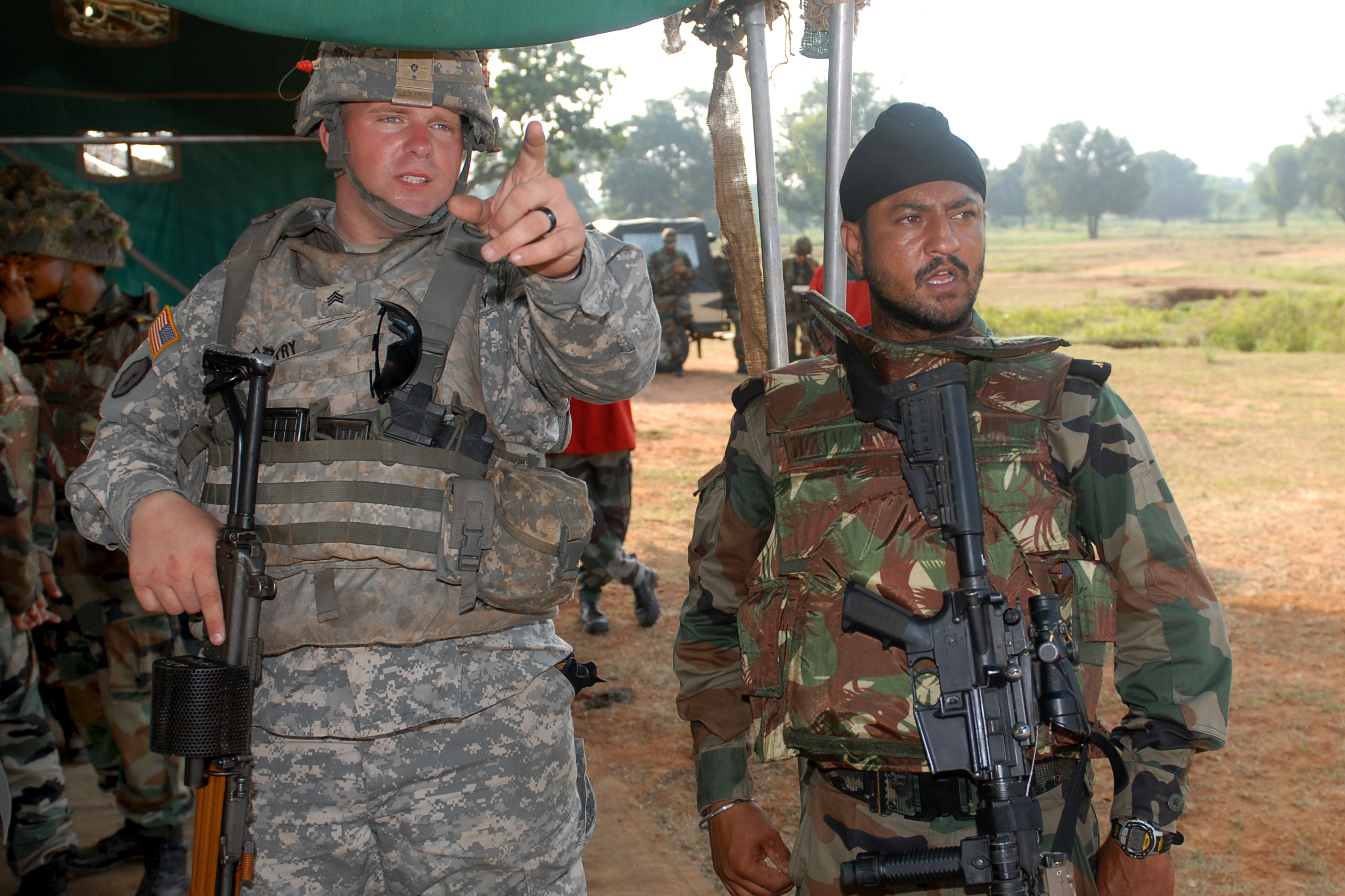 U.S. Army Sgt. John Gentry discusses how the teams will run together ...