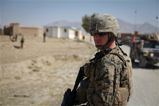 Sgt. Robert Settle conducts a joint patrol. | U.S. Department of War
