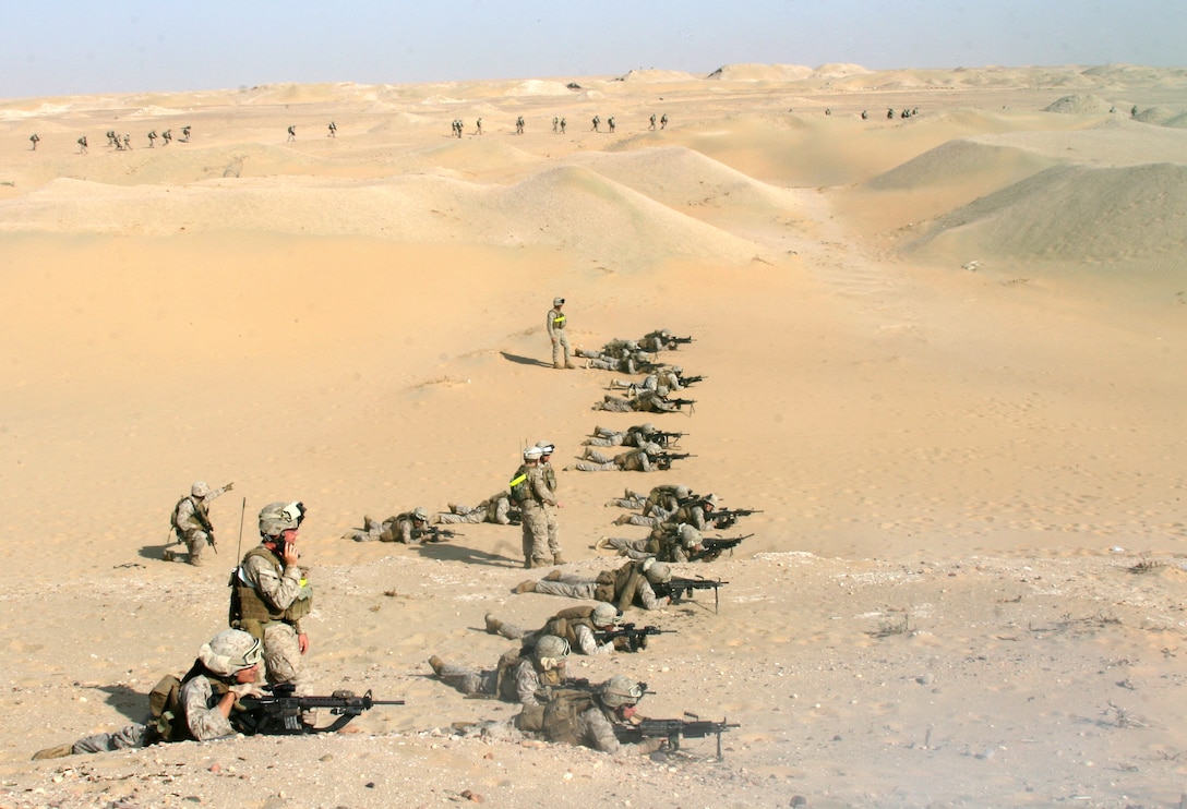 U.S. Marines engage enemy targets during a helicopter assault training ...