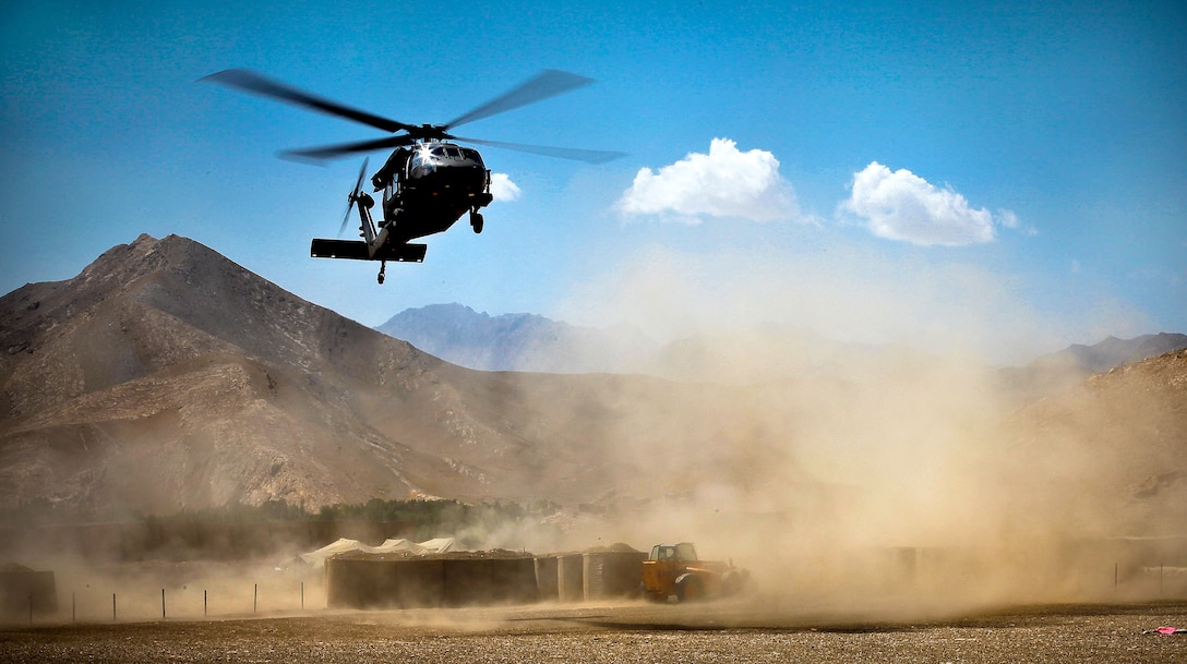 A U.S. Army UH-60 Black Hawk helicopter approaches the landing zone on ...