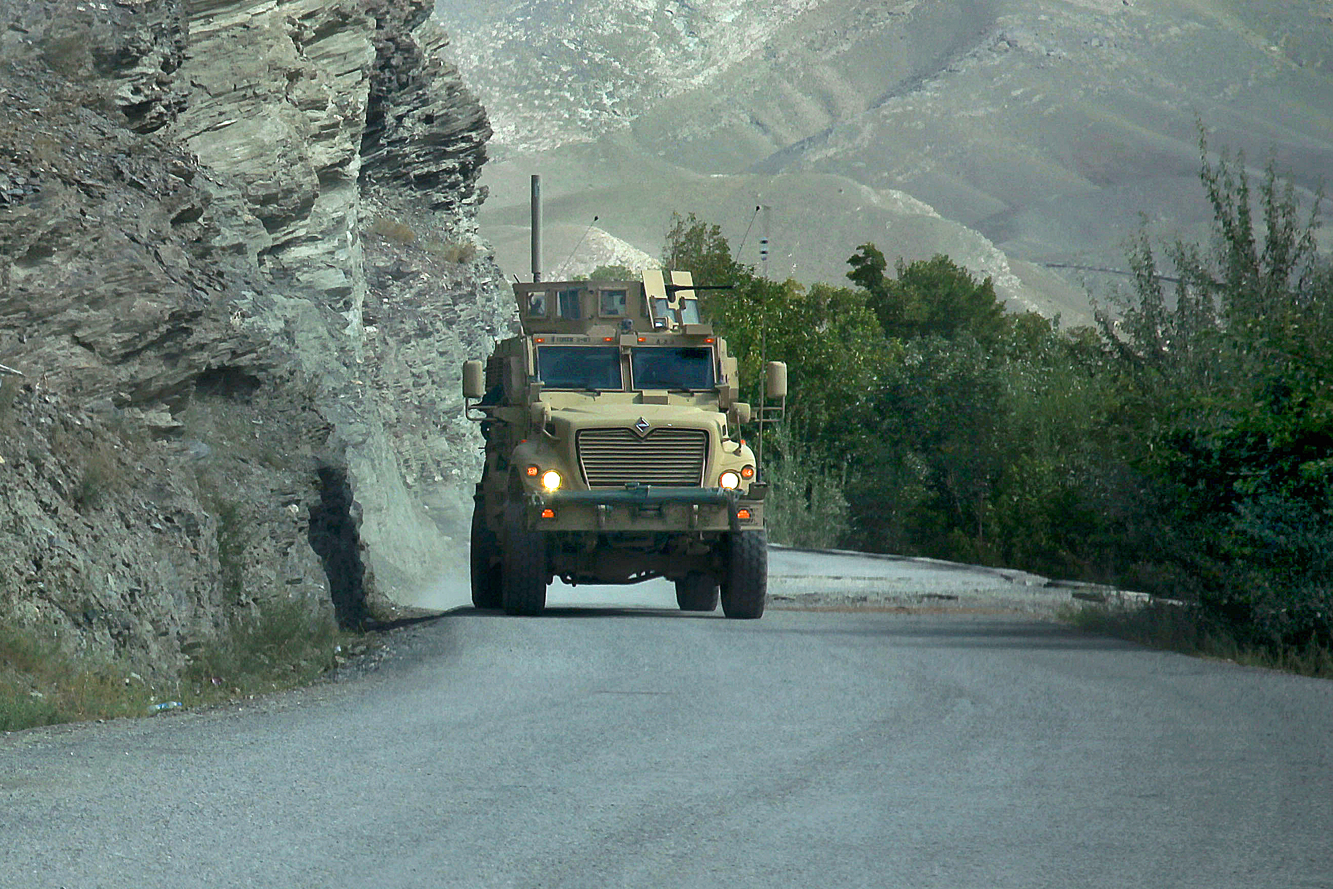 A U.S. Army mine resistant ambush protected vehicle follows a route ...