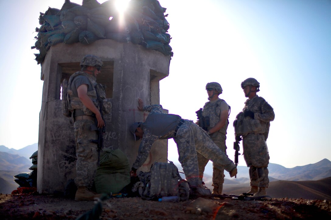 U.S. Army soldiers provide security at a observation post while ...