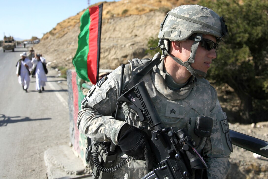 U.S. Army Sgt. David Conrad provides security while other members of the Kapisa-Parwan ...