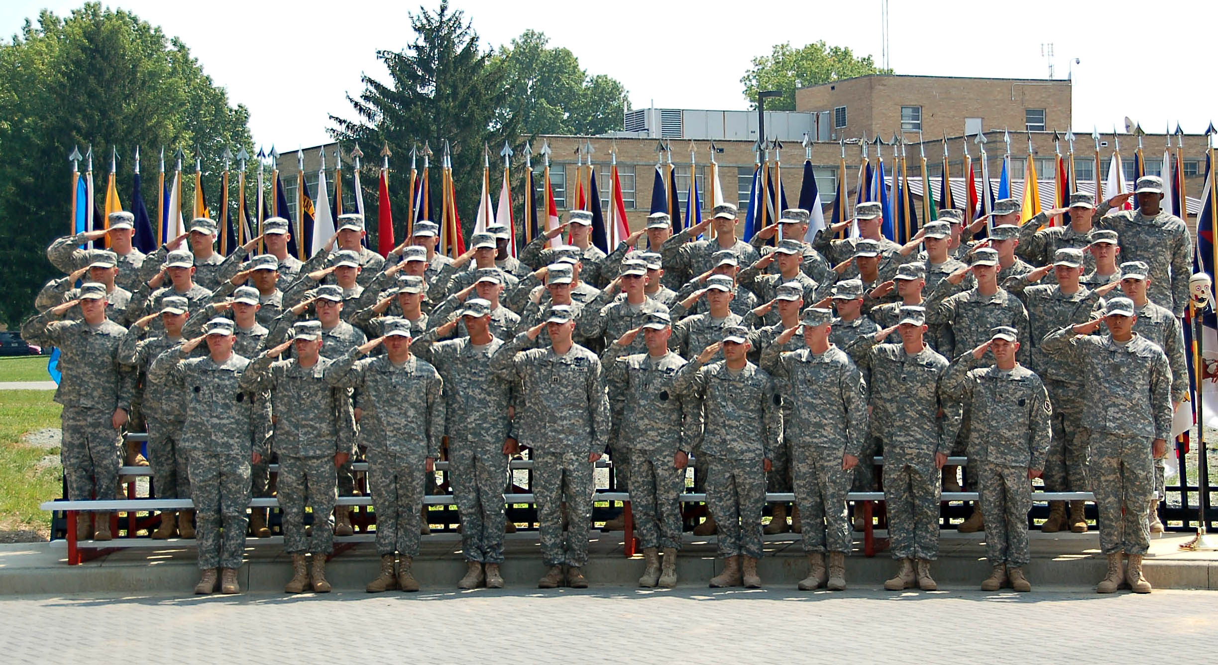 The first class of Patriot Academy students salutes the colors during ...