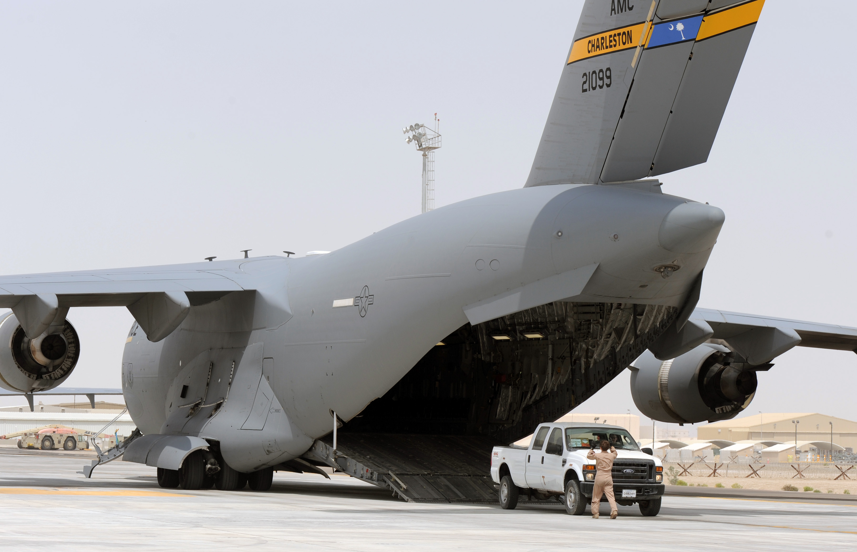 C-17s deliver, pick-up cargo at Southwest Asia base