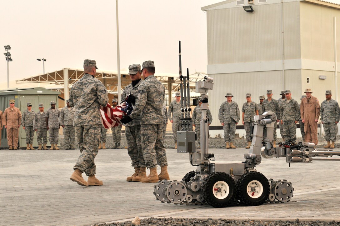 Deployed civil engineering squadron retreats with explosive ordinance robot