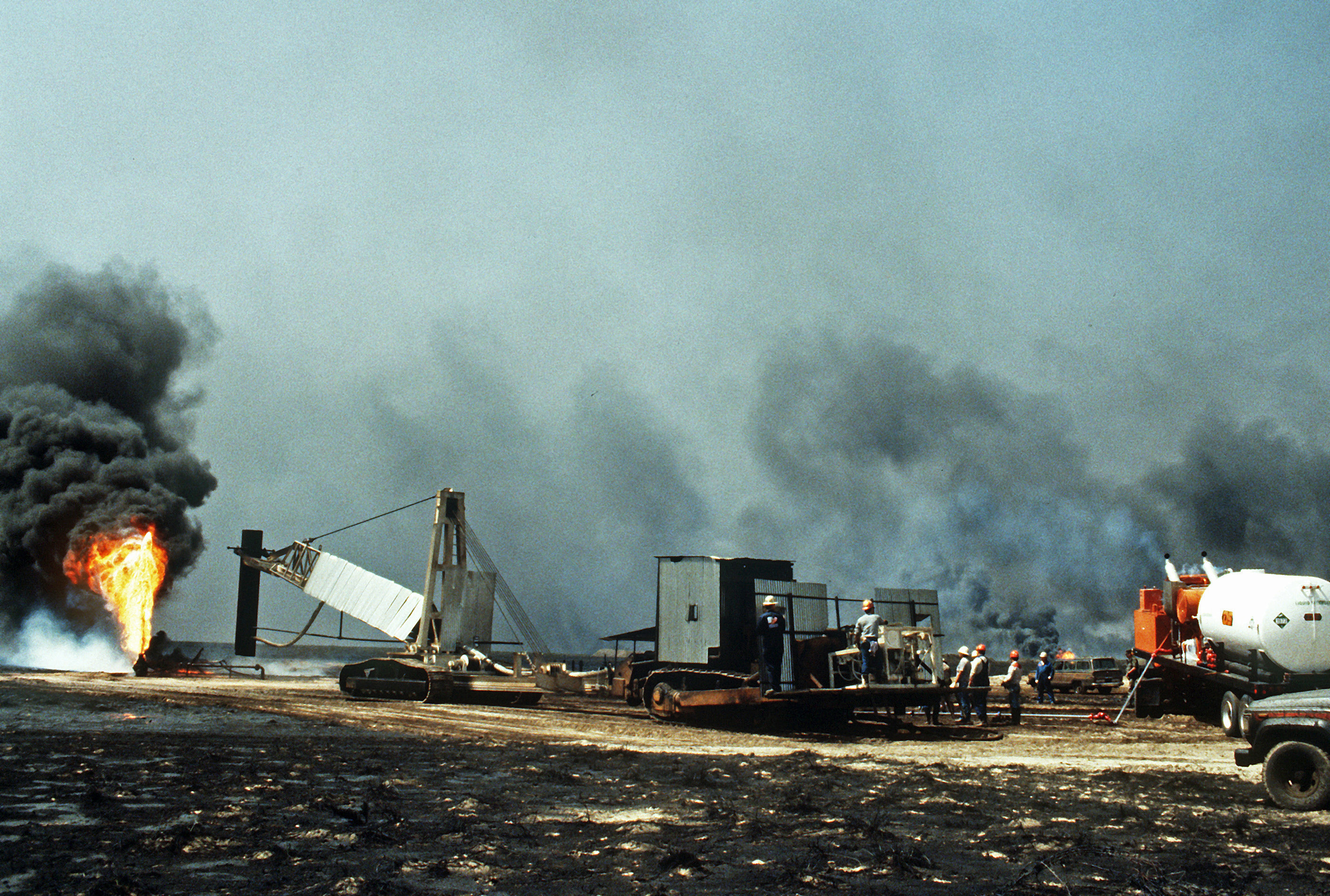 Firefighters from the Boots and Coots Oil Well Firefighting Company ...