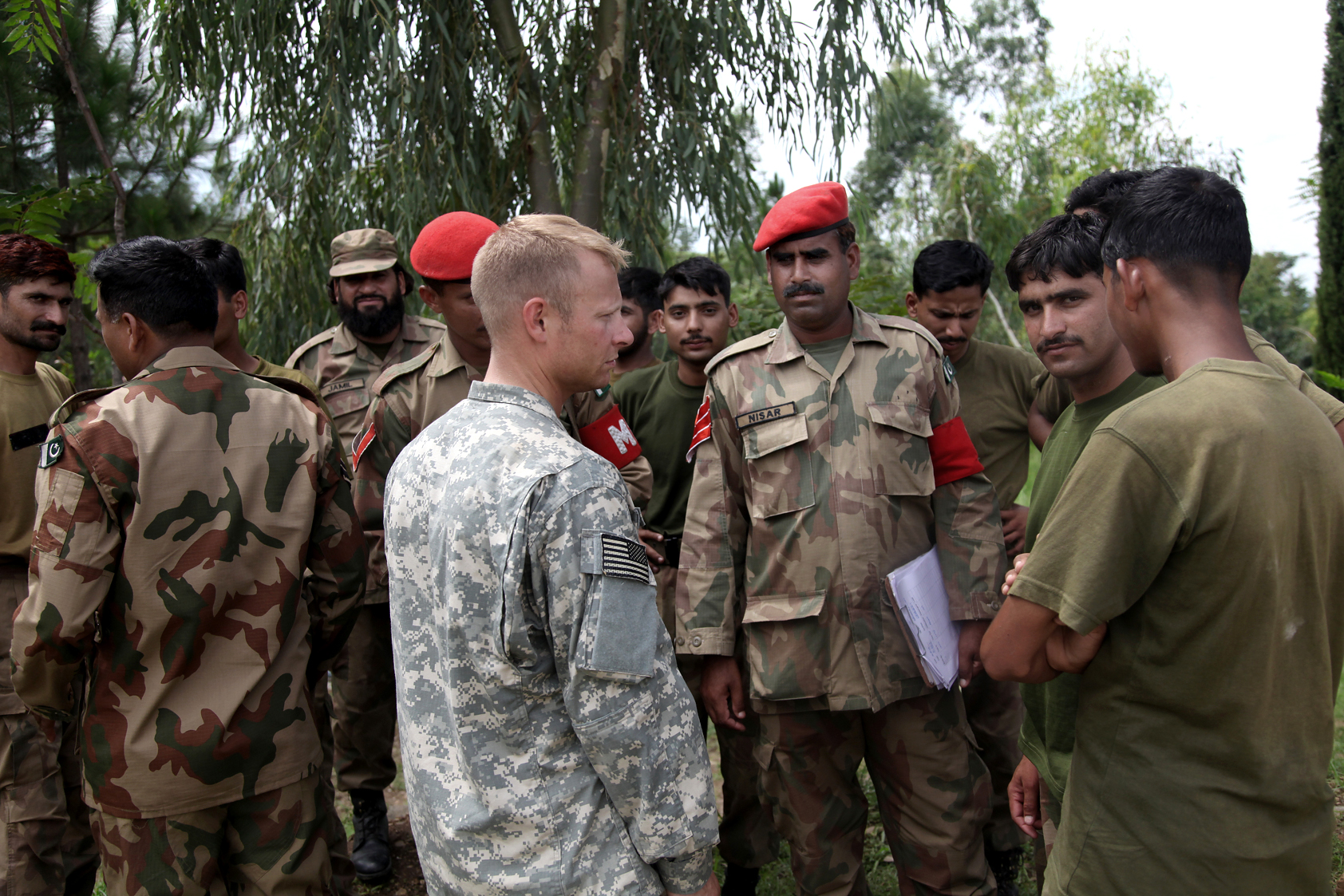 U.S. Army Sgt. William Kittle speaks with members of Pakistan's ...