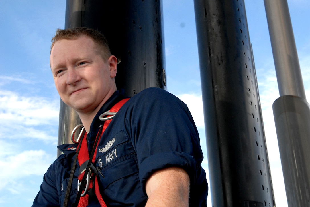 U.S. Navy Petty Officer 3rd Class Sean Smith, a fire control technician ...