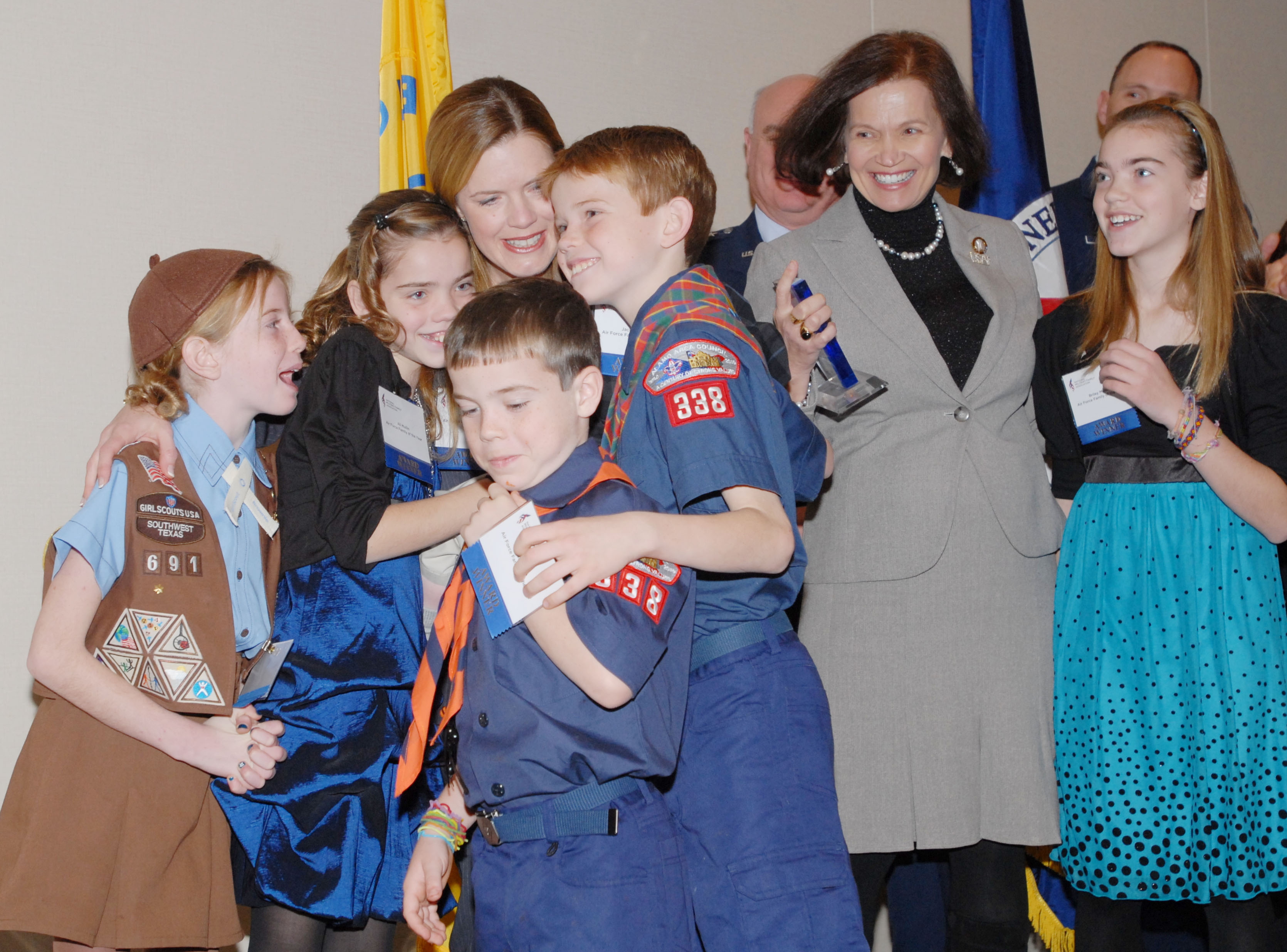 Trasi Mullin hugs four of her six children after being named the ...