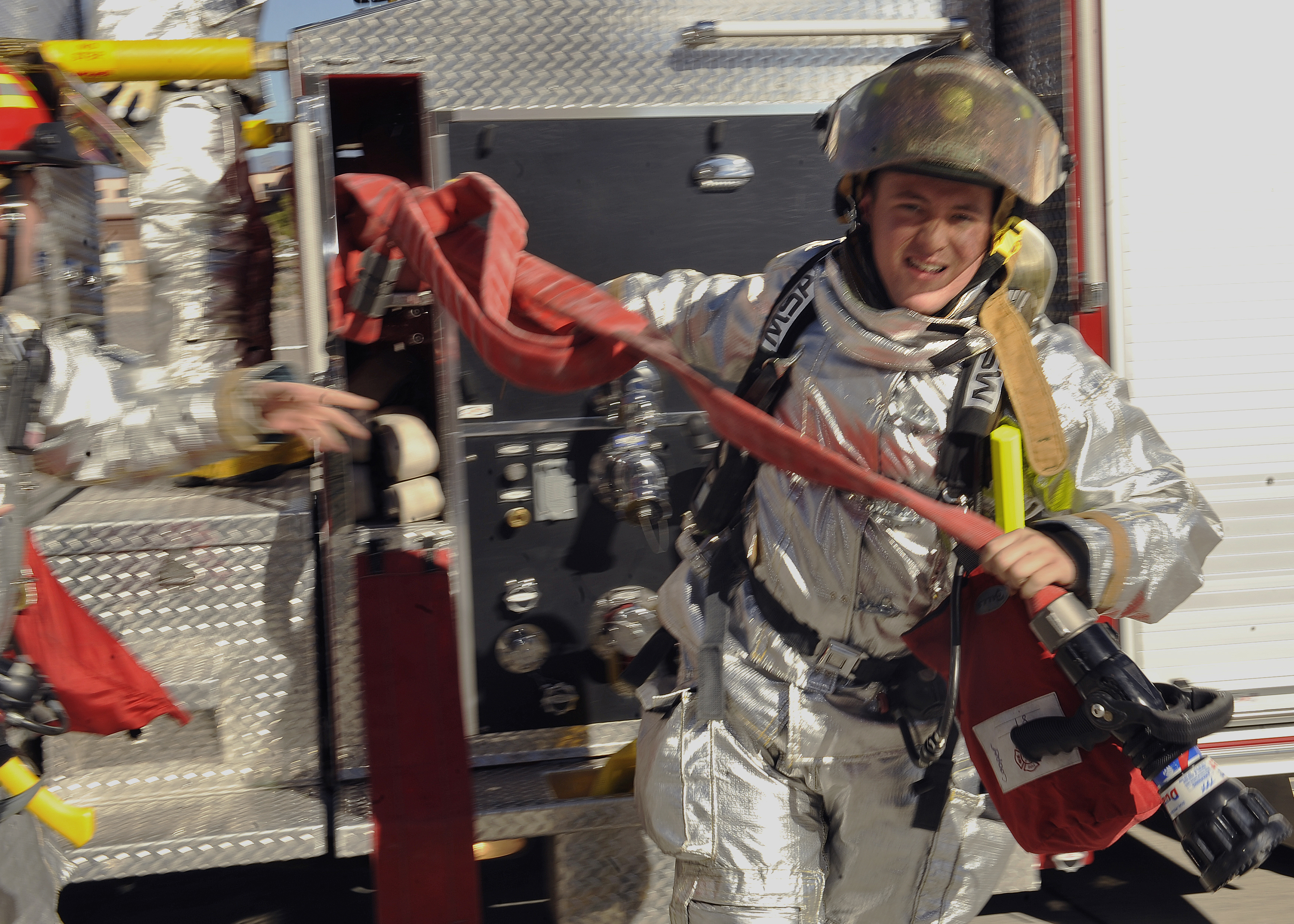 Firefighters perform structural fire exercise