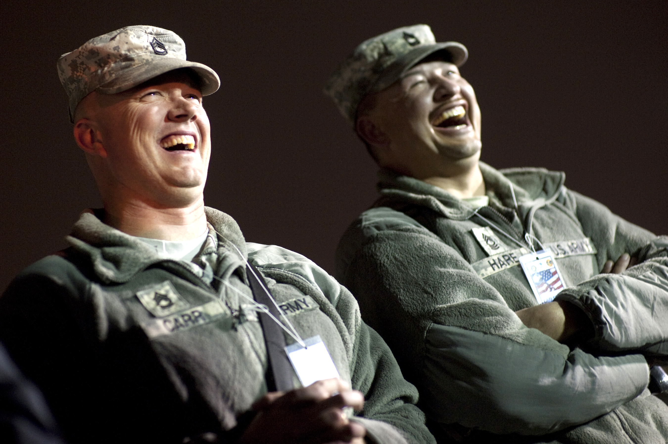 Soldiers assigned to Camp Victory, Iraq, laugh at the comedy of Robin ...