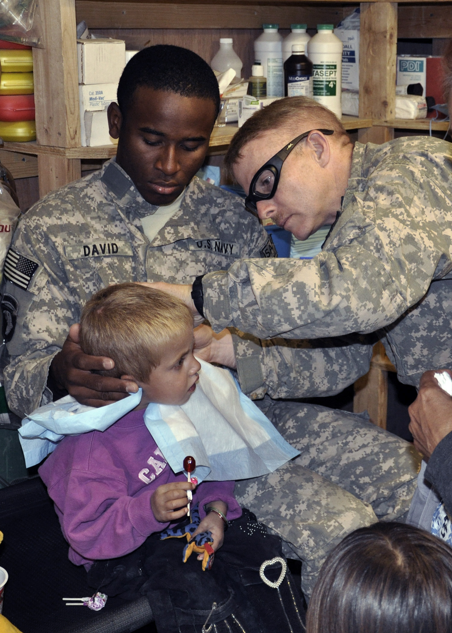 U.S. Navy Cmdr. Harold Groff, right, and Petty Officer 2nd Class Steve ...