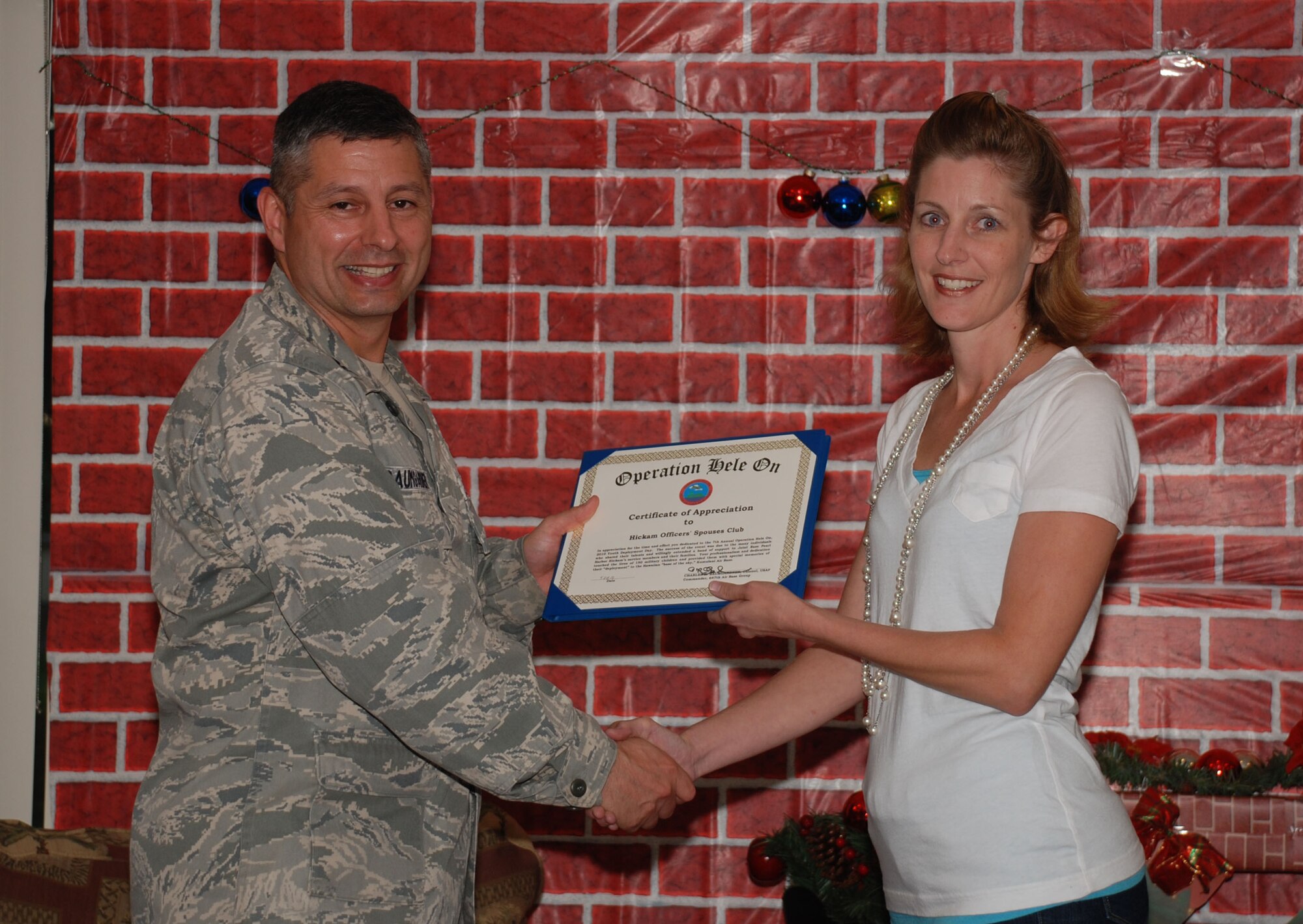 Deployed Spouses Club hosts Christmas party > 15th Wing > Article Display
