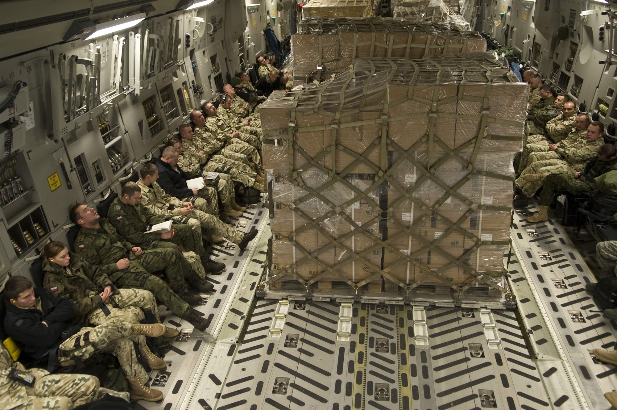 Multinational airlifter flies supplies to Poland, Afghanistan ...