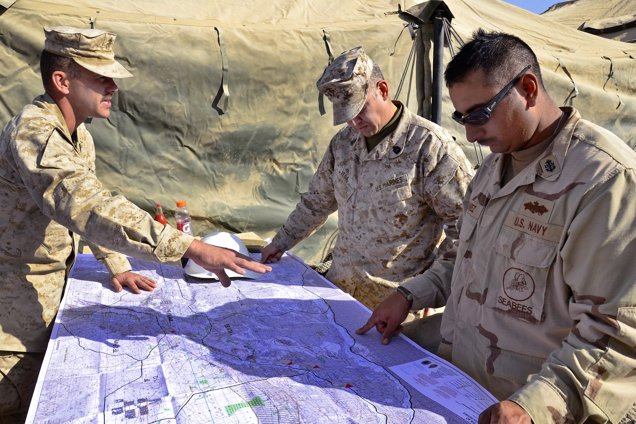 U.S. Marine Corps Master Sgt. John Kroll, left, Gunnery Sgt. Javier ...