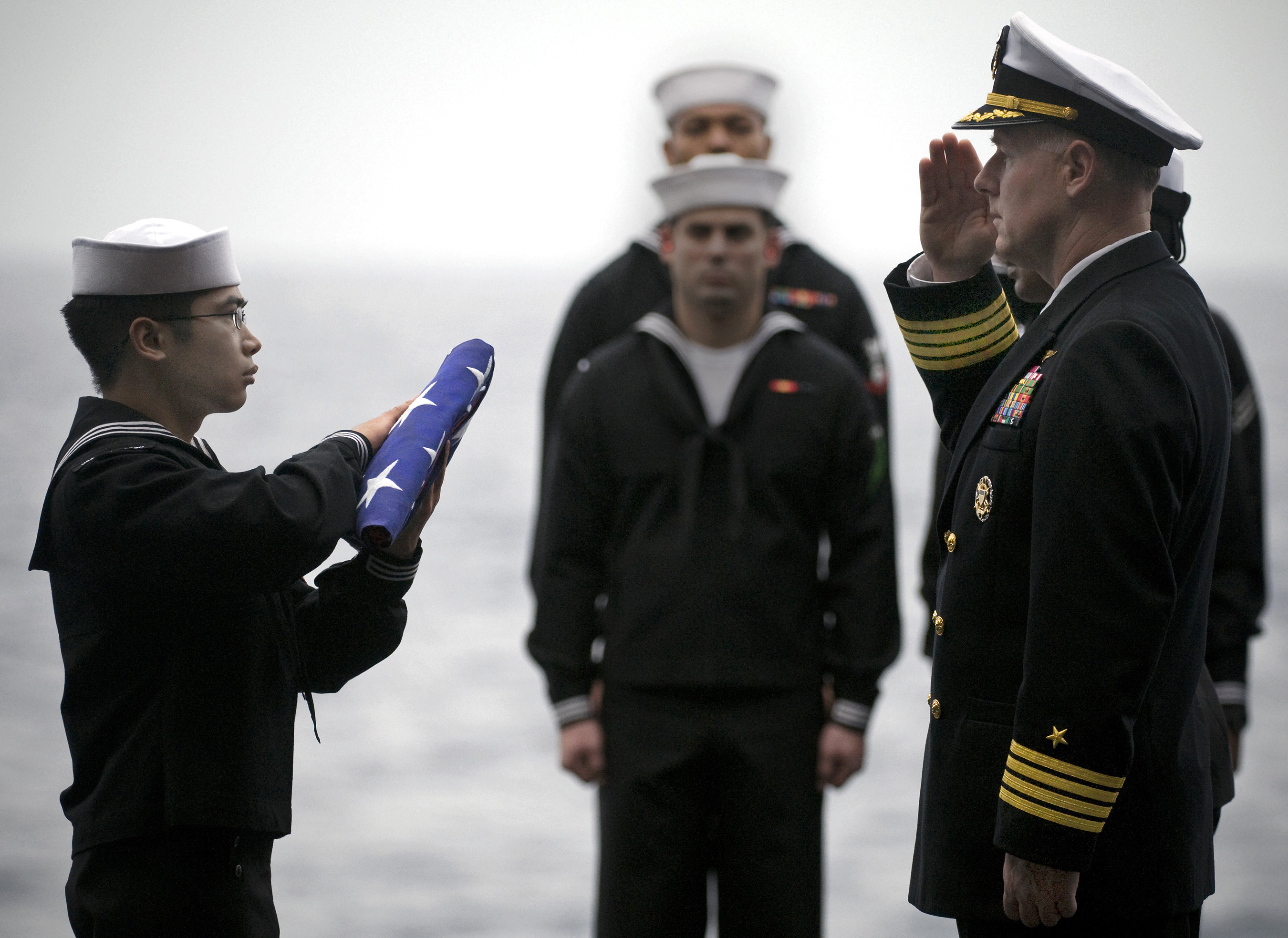 U.S. Navy Capt. Bruce H. Lindsey, commanding officer aboard the ...