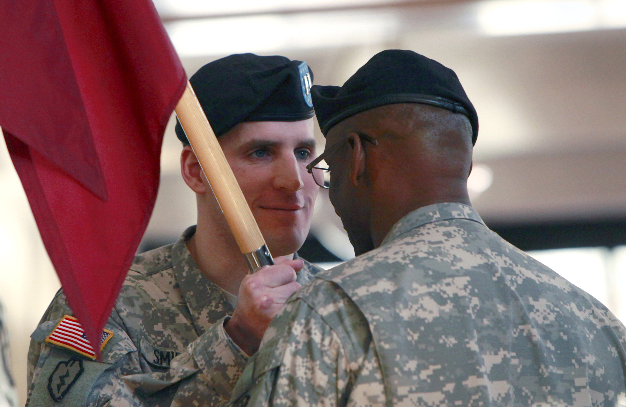 Army Capt. Scott M. Smiley passes the guidon back to 1st Sgt. Deon E ...