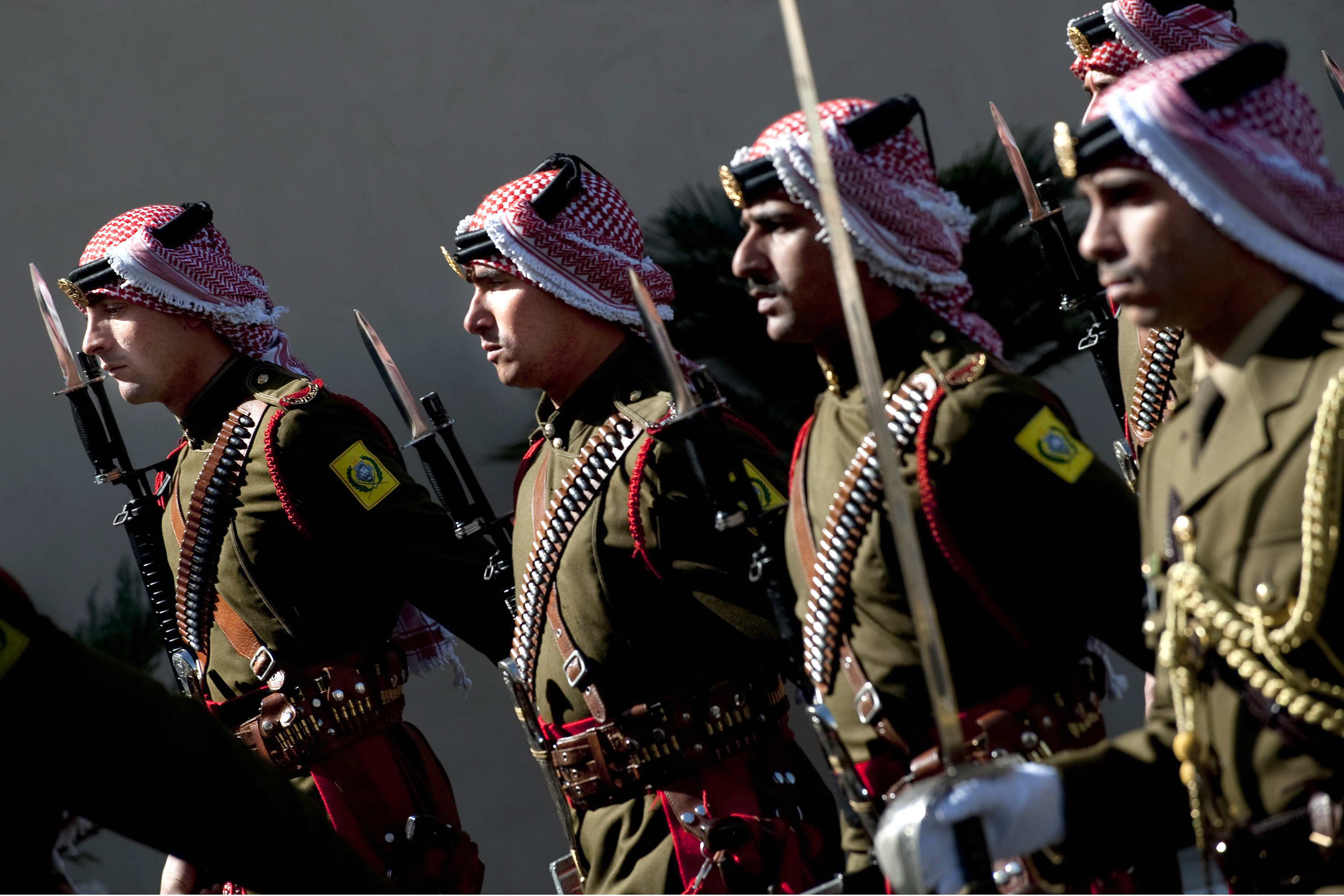 Members of a Jordanian honor guard welcome U.S. Navy Adm. Mike Mullen ...