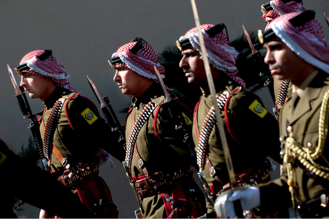 Members of a Jordanian honor guard welcome U.S. Navy Adm. Mike Mullen ...