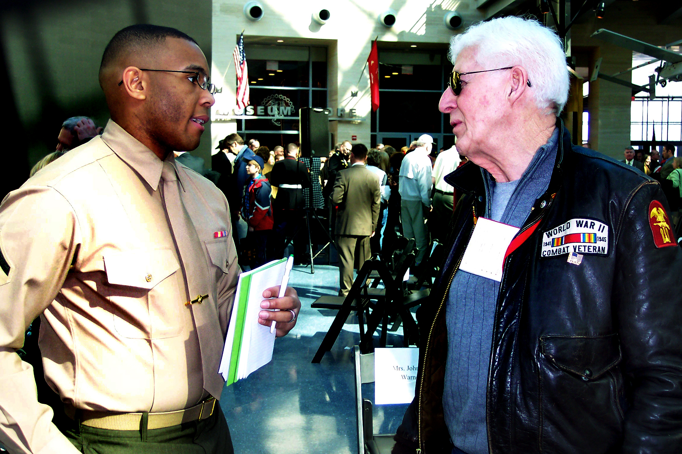 Ron “Rondo” Scharfe, right, a veteran of the Battle of Iwo Jima, talks ...