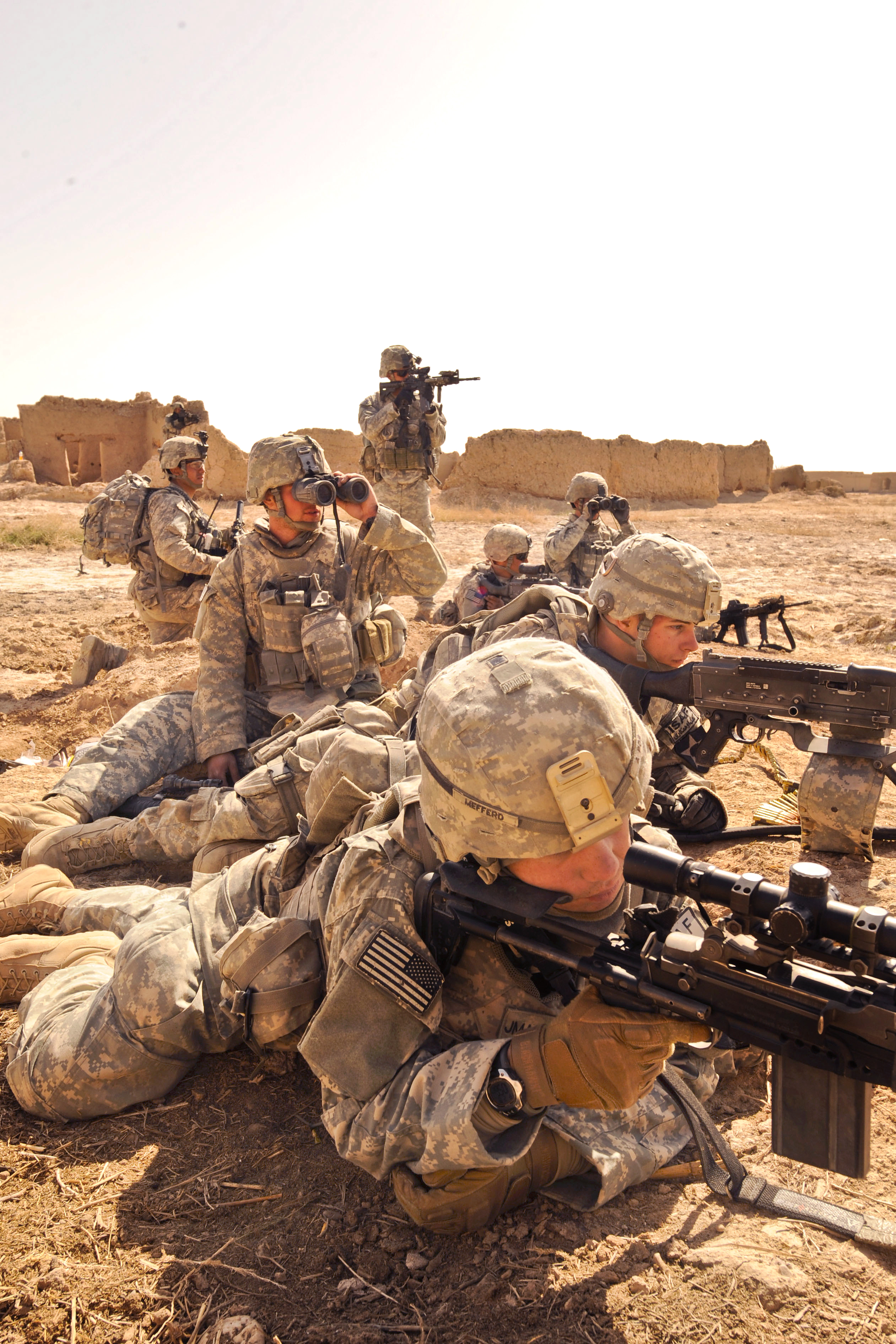 U.S. Army soldiers engage in a small-arms firefight with enemy forces ...