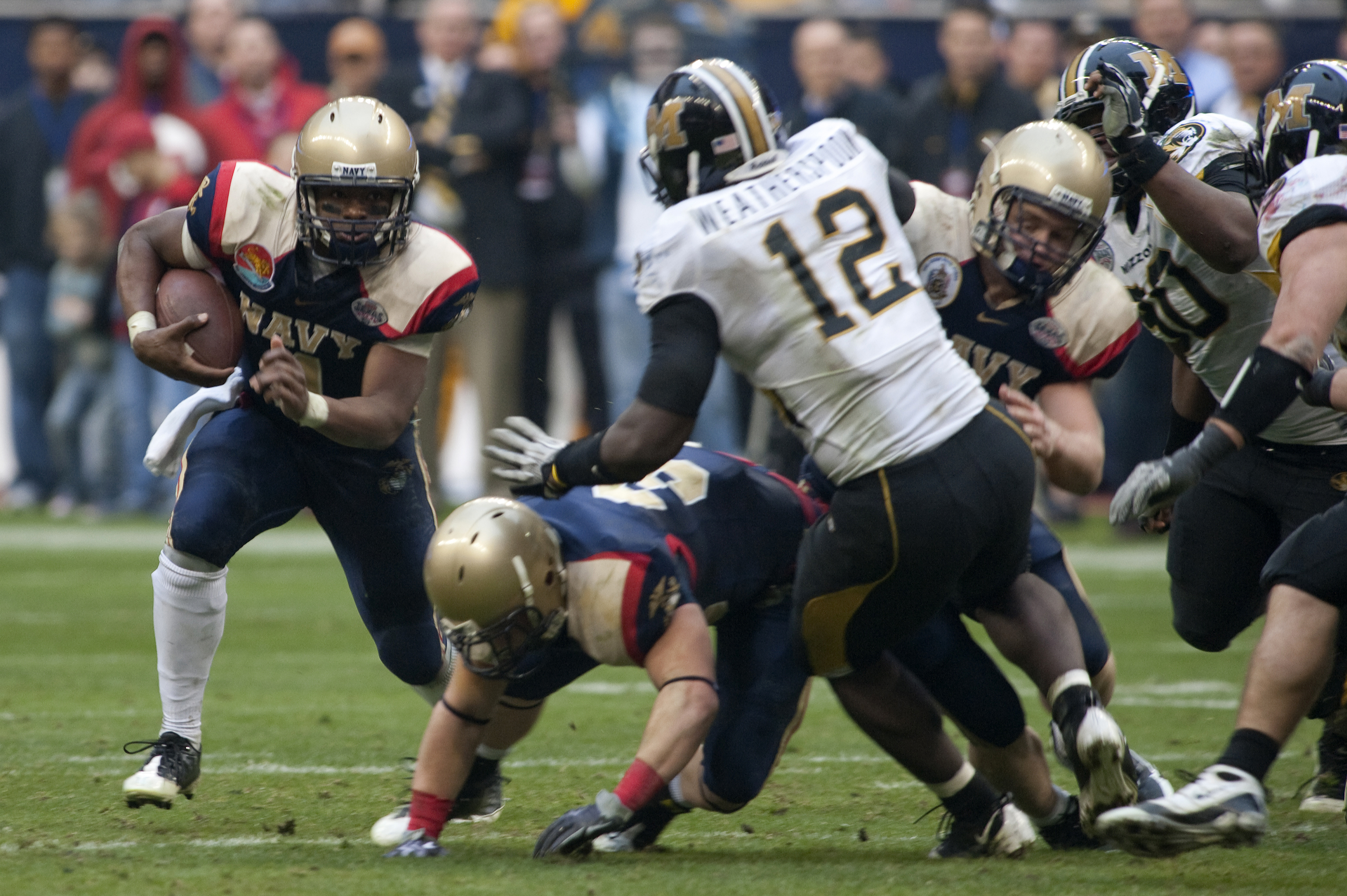 U.S. Naval Academy Midshipmen quarterback Ricky Dobbs runs during the ...