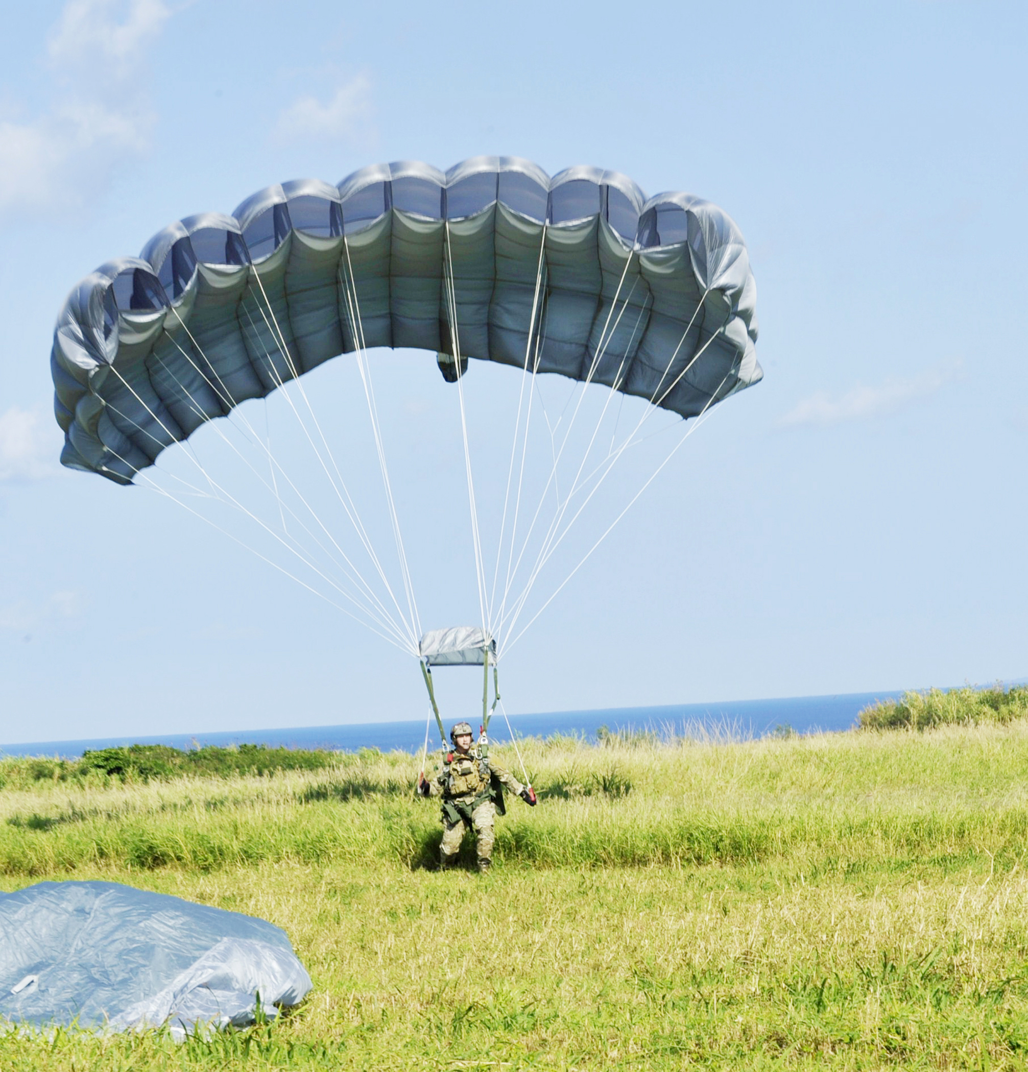 Kadena Airmen jump over le Shima Island