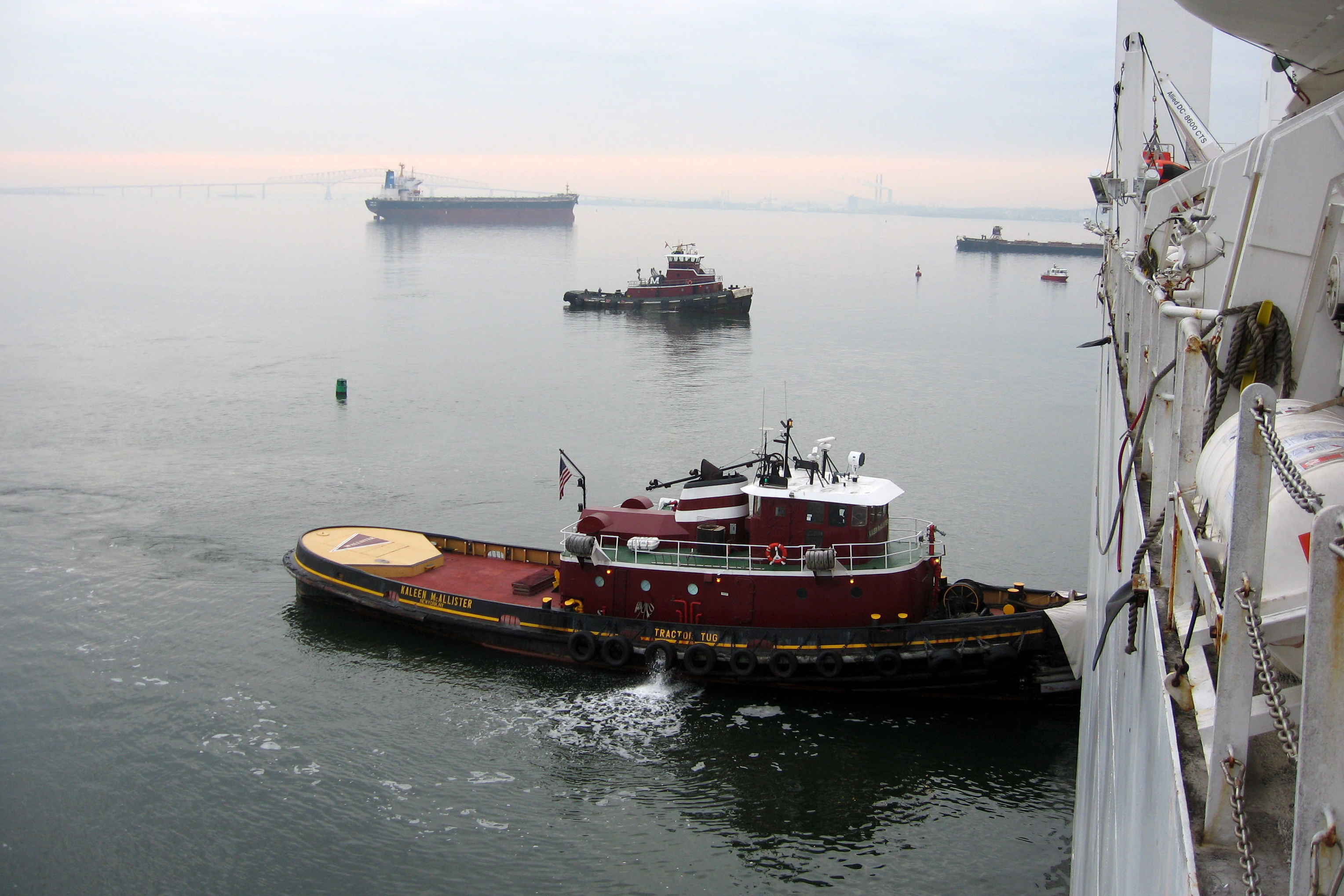 Tugs push the USNS Comfort from its pier in Baltimore harbor as the U.S ...