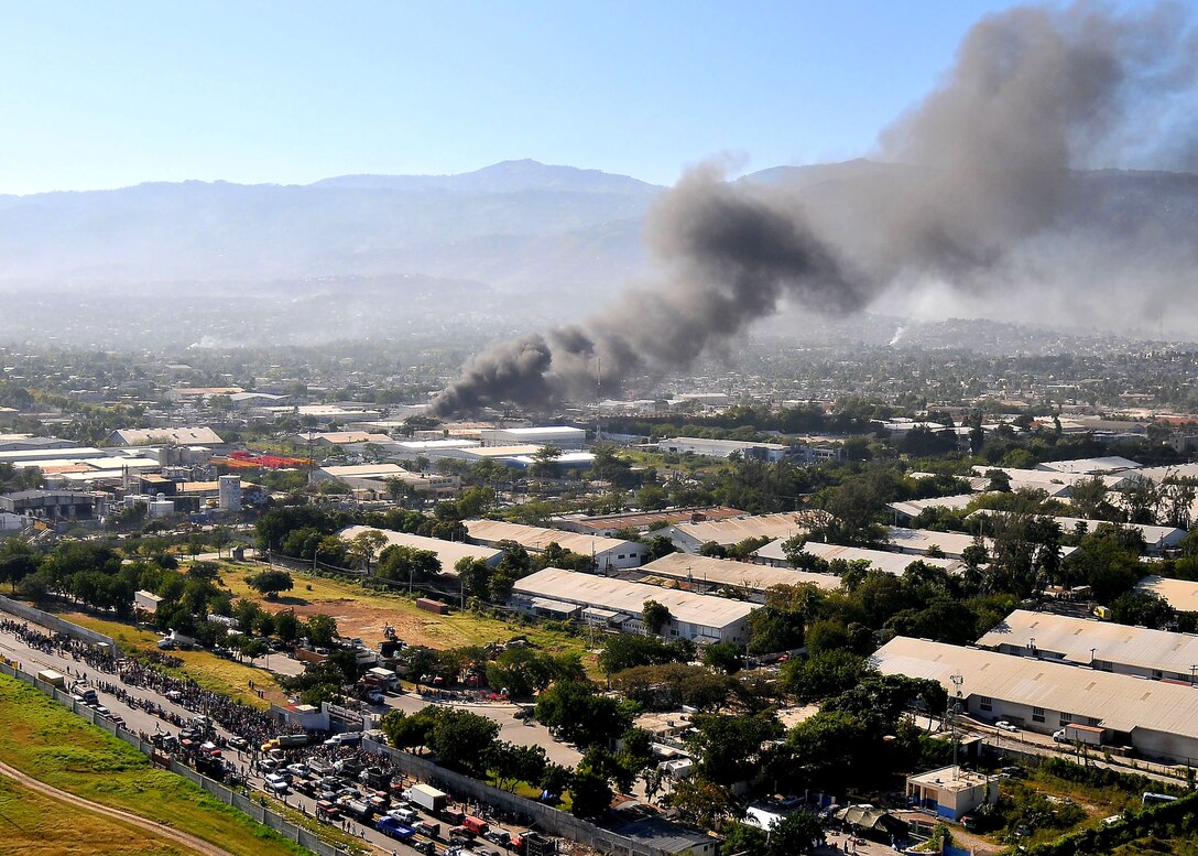 Smoke rises from a fire in Port-au-Prince, Haiti, as seen from a U.S ...