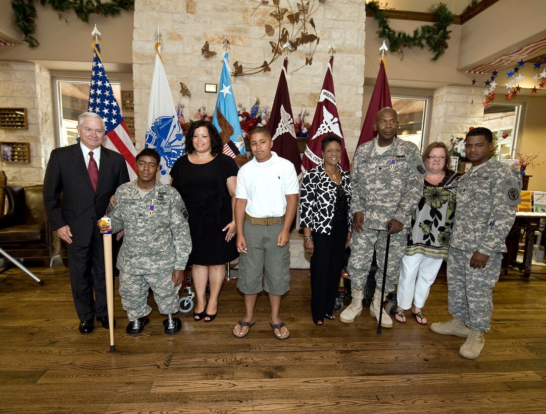 Defense Secretary Robert M. Gates takes a photo with Army Sgt. Legrand ...