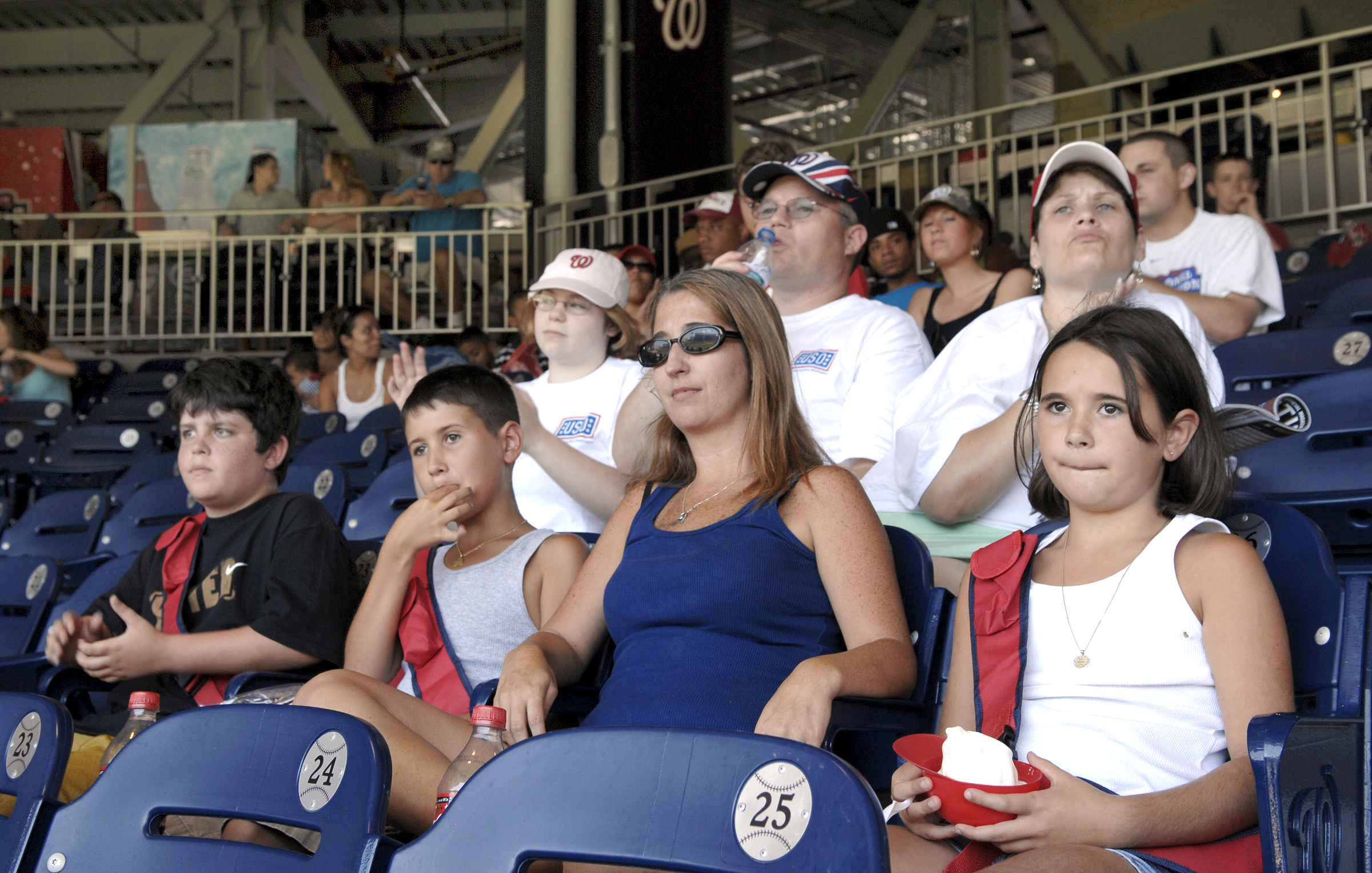 Amy Burdette, center right, her children, Abbie, 8, far right, and CJ ...