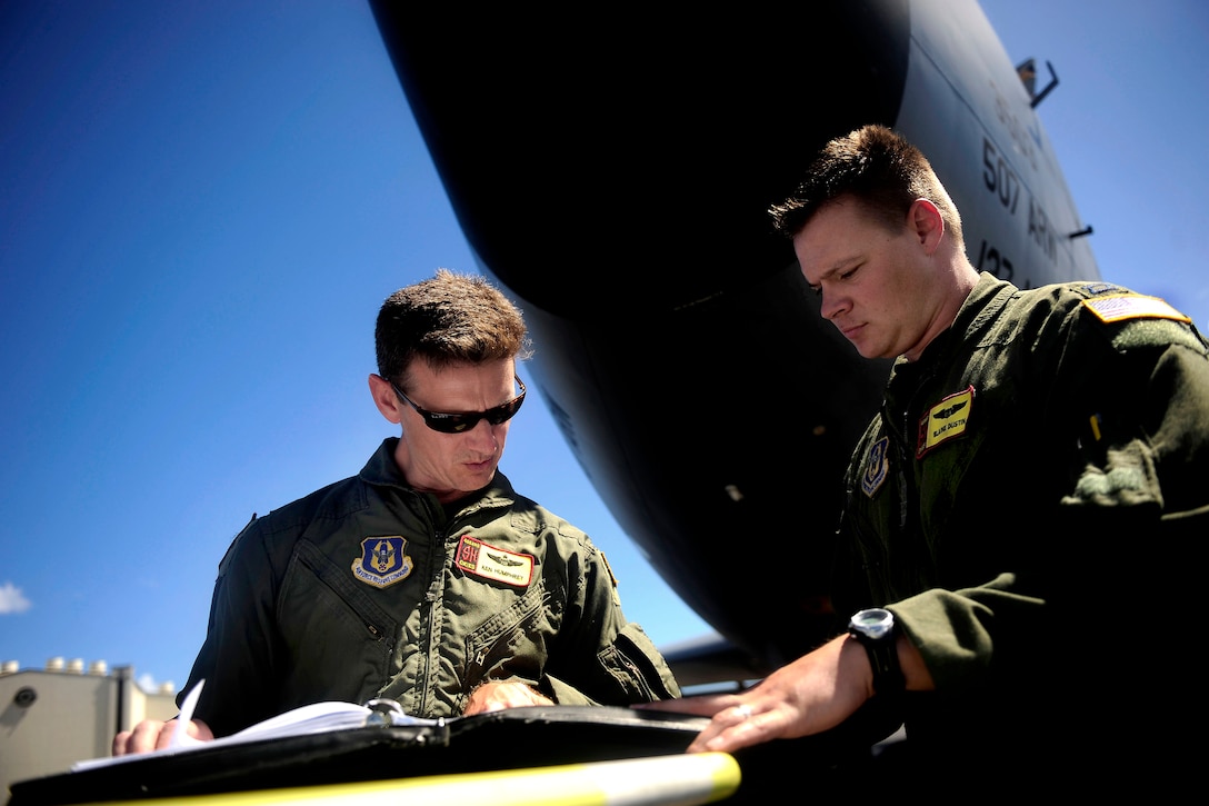 U.S. Air Force Lt. Col. Ken Humphrey, left, and Capt. Blaine Dustin ...