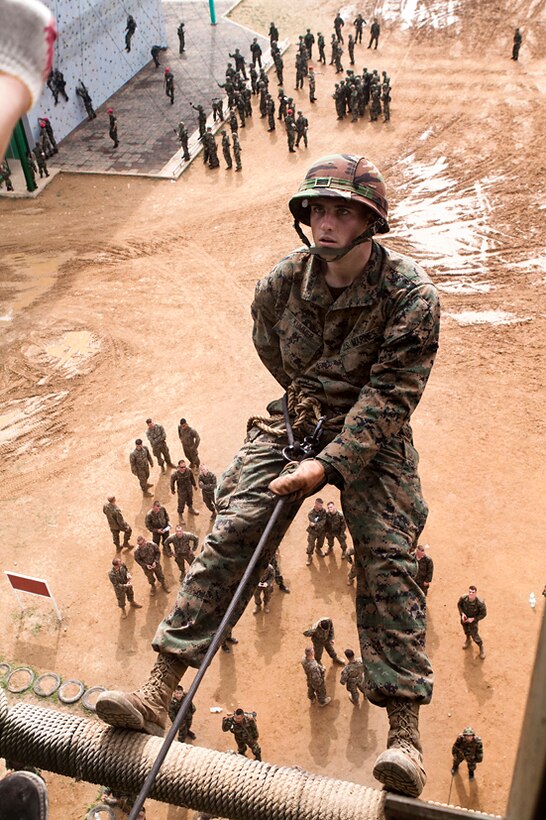 U.S. Marine Corps Lance Cpl. Cody Kummer prepares himself to rappel ...