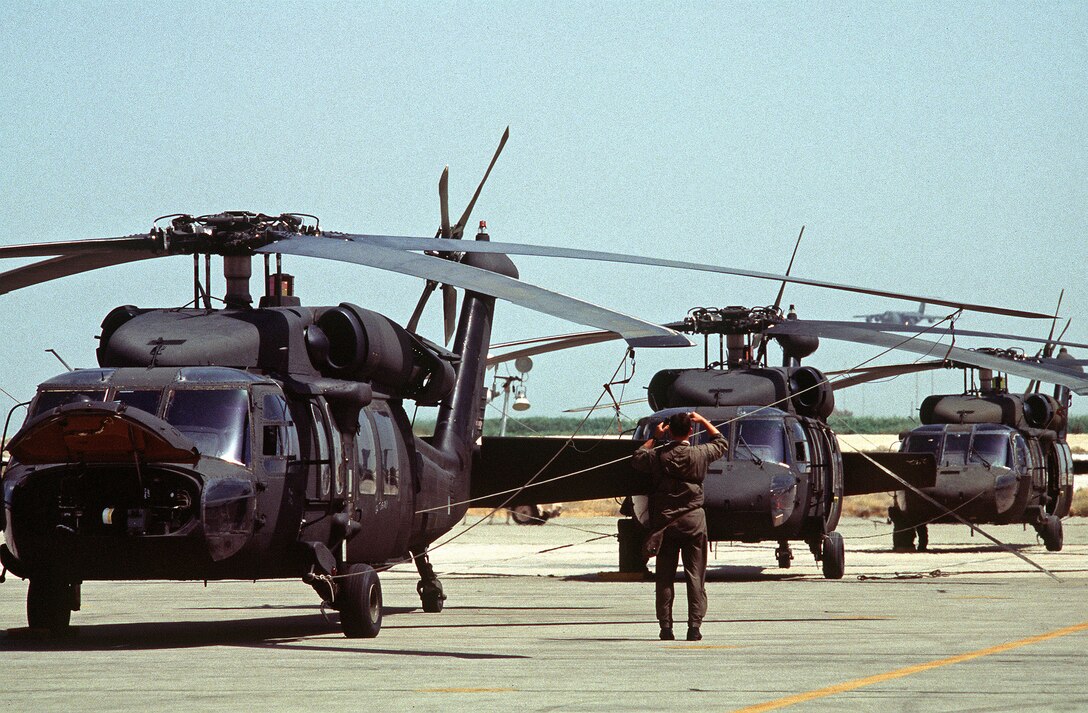 A U.S. Army soldier begins a preflight check on a UH-60 Black Hawk ...