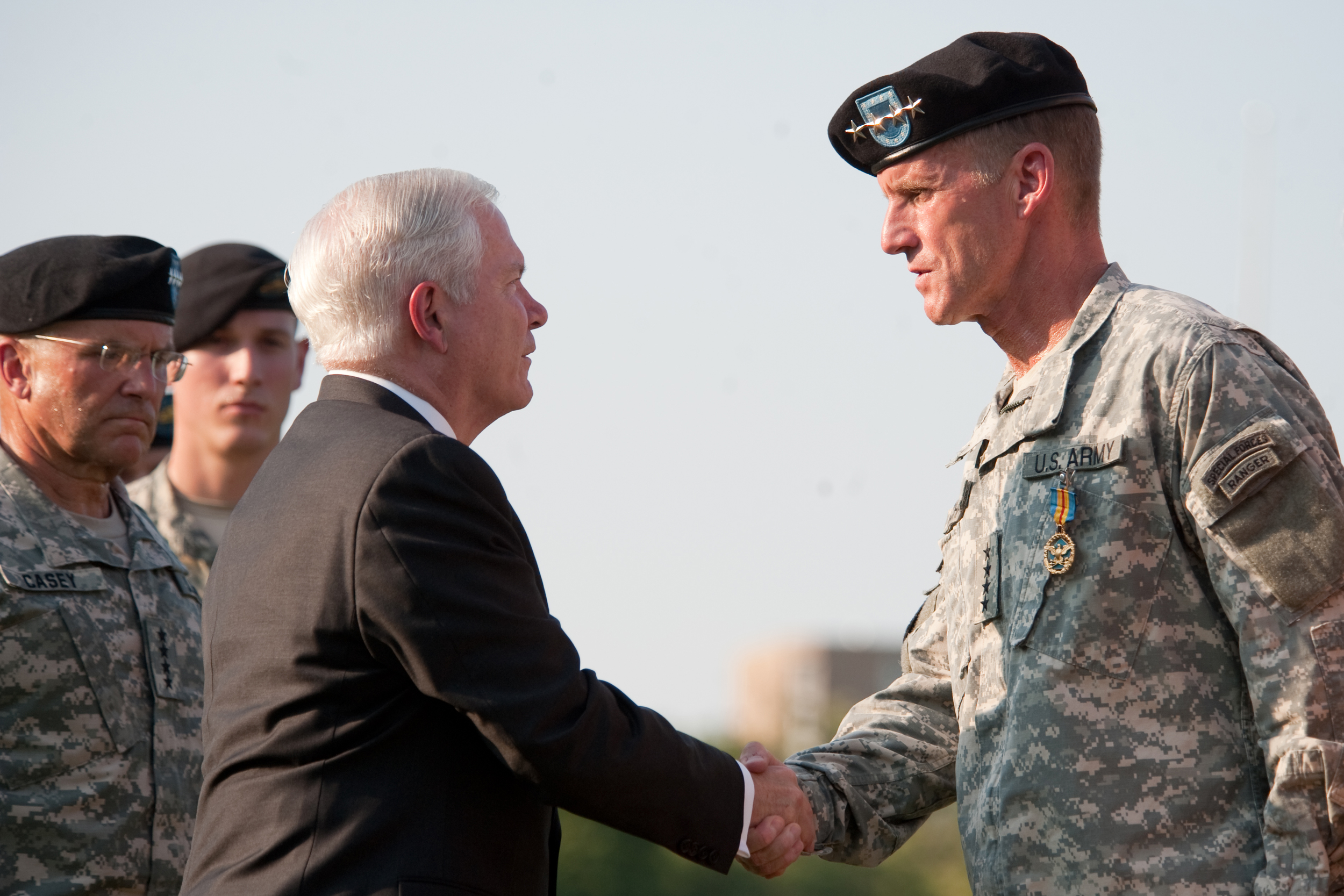 U.S. Defense Secretary Robert M. Gates, left, shakes hands with U.S ...