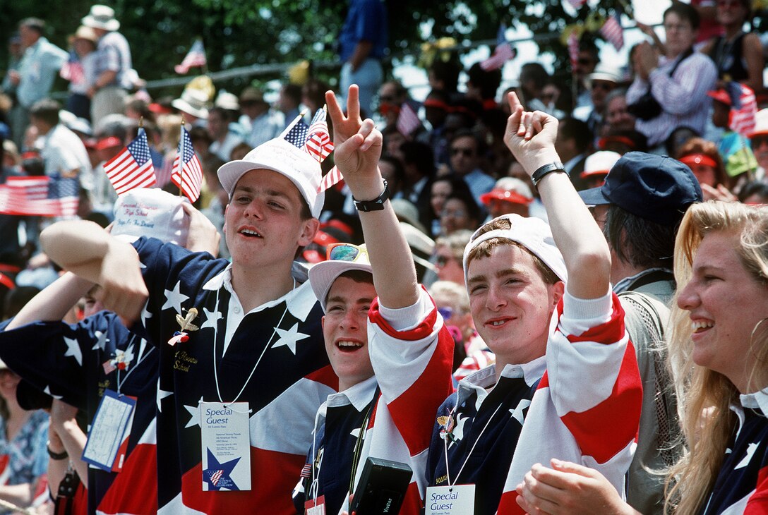 Young crowd members display their enthusiasm for U.S. military troops ...