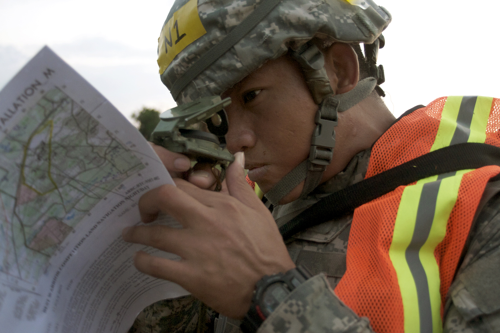 U.S. Army Sgt. 1st Class Marc T. Facunla shoots an azimuth using the ...