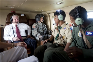 Secretary Gates speaks with Boy Scout Vasan Ayyar and his father.