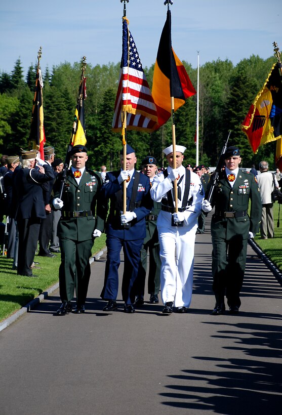 A joint color guard presents the colors at the Ardennes American ...