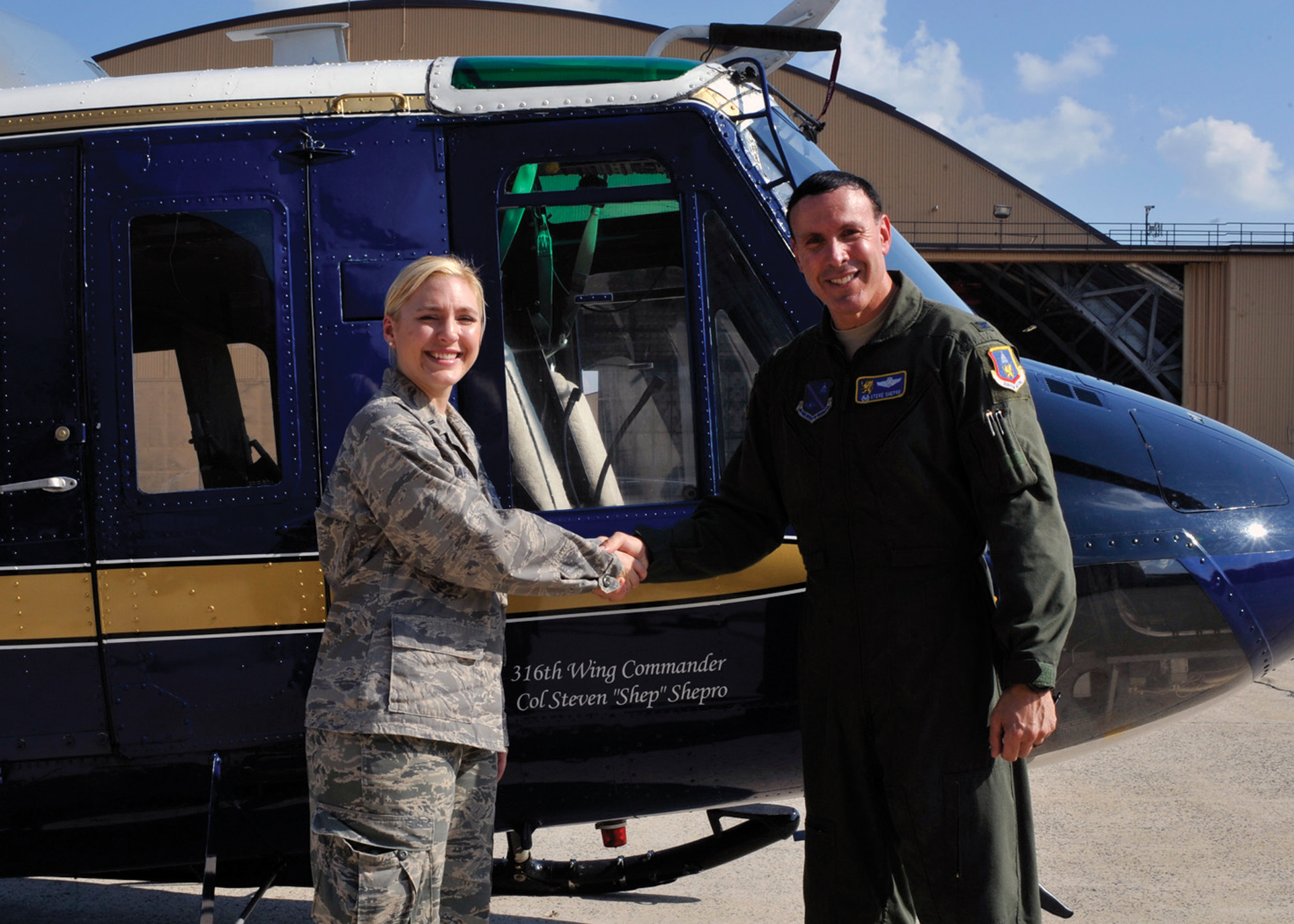 Former 316 WG commander coins exec