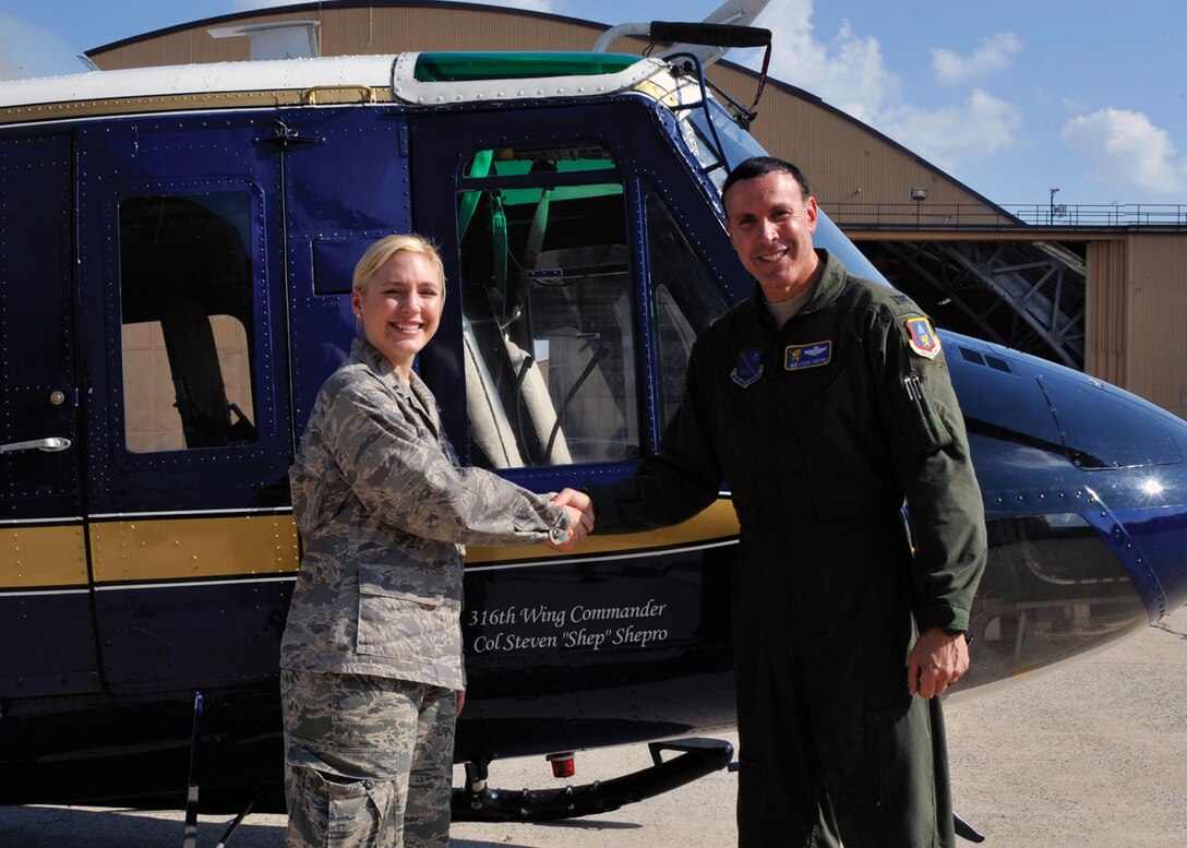 Former 316 WG commander coins exec