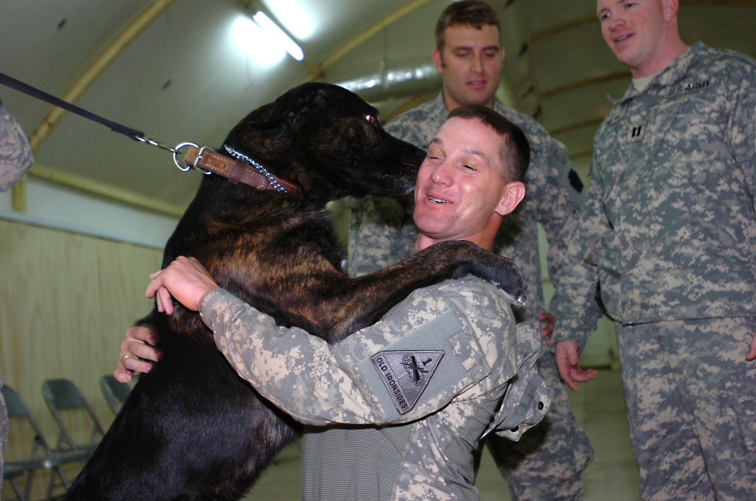U.S. Army Staff Sgt. Christopher Bain visits with a military working ...