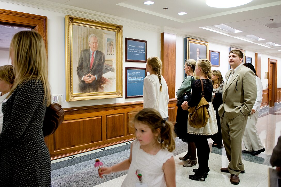 Family members of Defense Secretary Donald H. Rumsfeld look at his ...