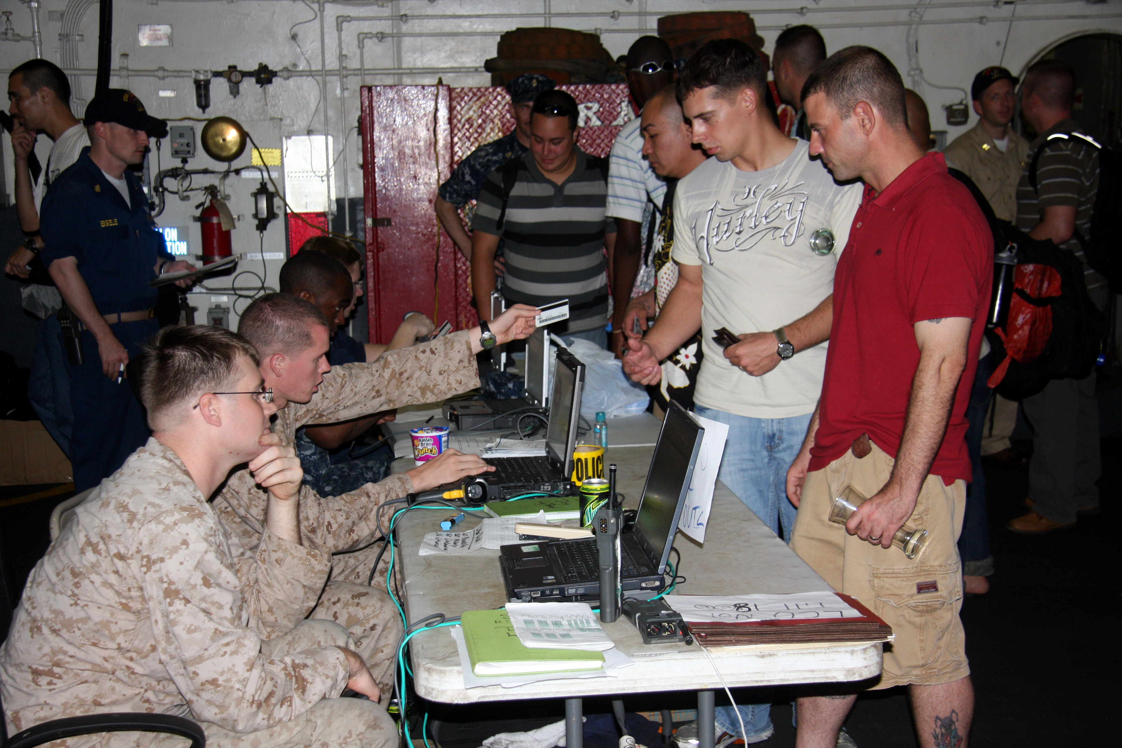100628-M-4752B-Marines check-in from liberty on USS Nassau.jpg