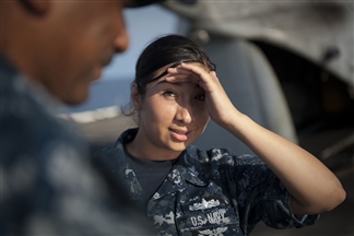 Chief Master-at-Arms Gerard talks to Petty Officer 1st Class Garnet ...