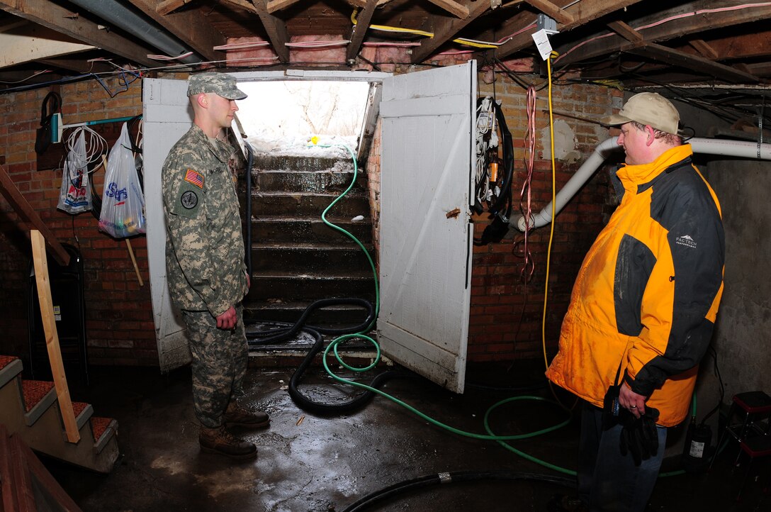 U.S. North Dakota Army National Guard 2nd Lt. Chad Worrel visits with ...