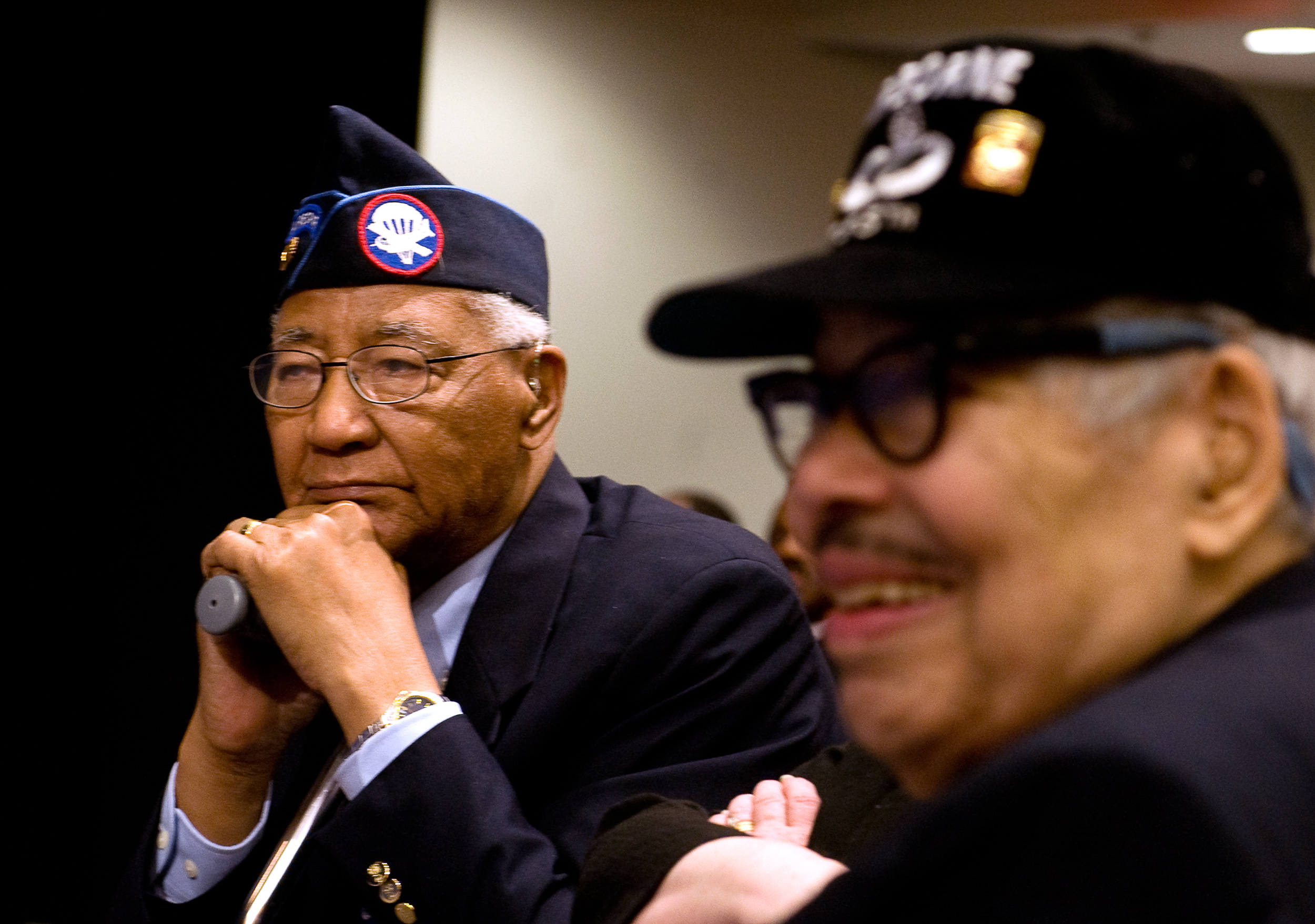Walter Morris, left, and Roger Walden, right, listen into to the ...